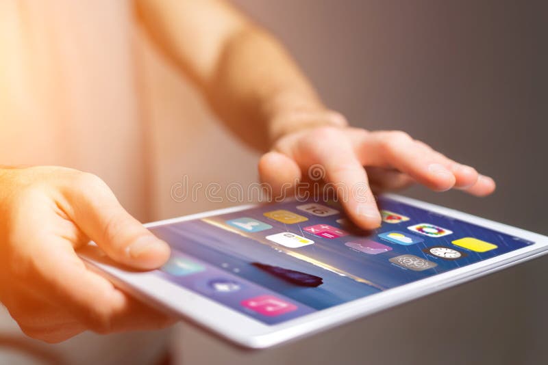 Hand Holding Black Tablet with Operating System Screen Stock Photo ...