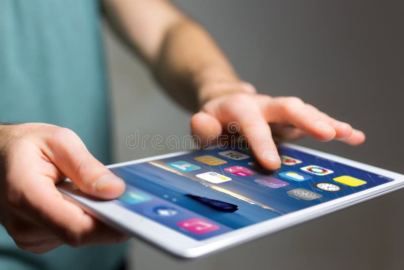 Hand Holding Black Tablet with Operating System Screen Stock Photo ...