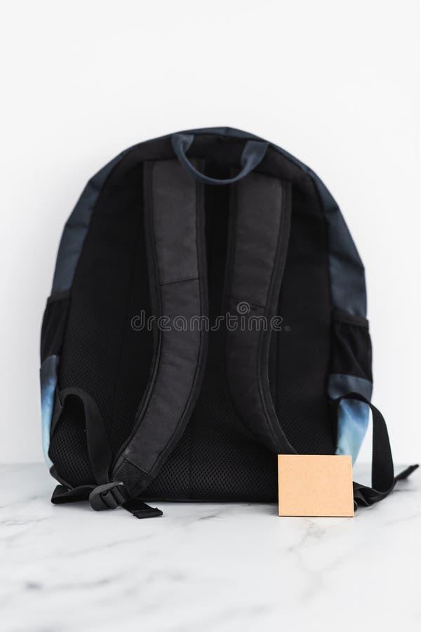 Hand Holding Blank Message Label in Front of Backpack, Concept of ...