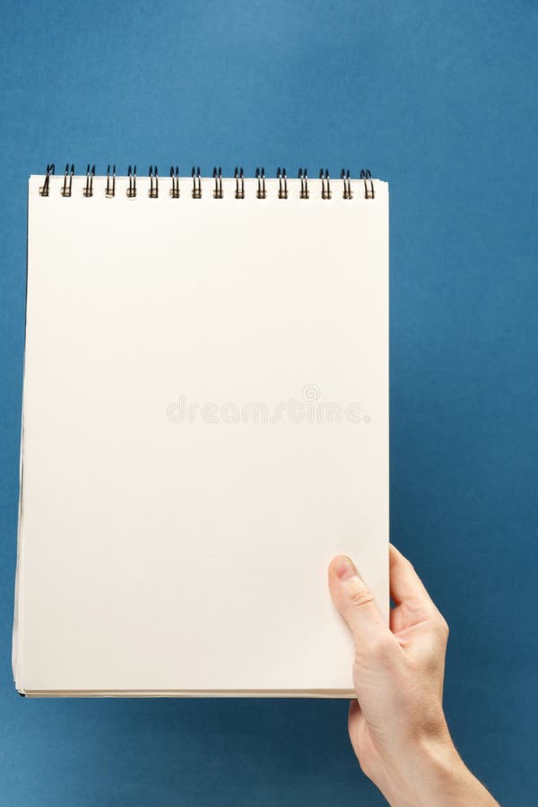Hand holding blank notepad stock photo. Image of business - 17765486