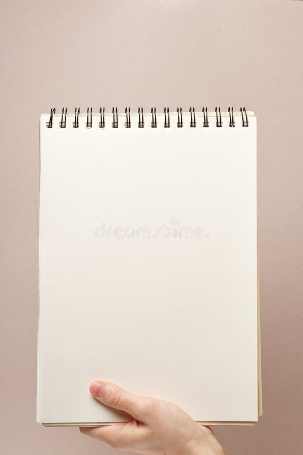 Hand holding blank notepad stock photo. Image of business - 17765486