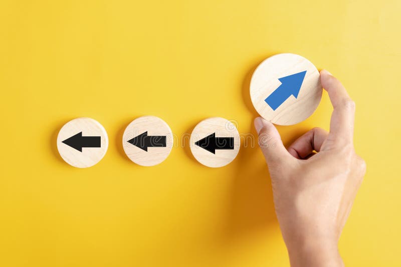 Hand Holding Blue Arrow and Different Direction Facing Opposite ...