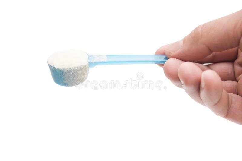 Hand Holding a Blue Spoon of Powdered Milk Stock Image - Image of spoon ...