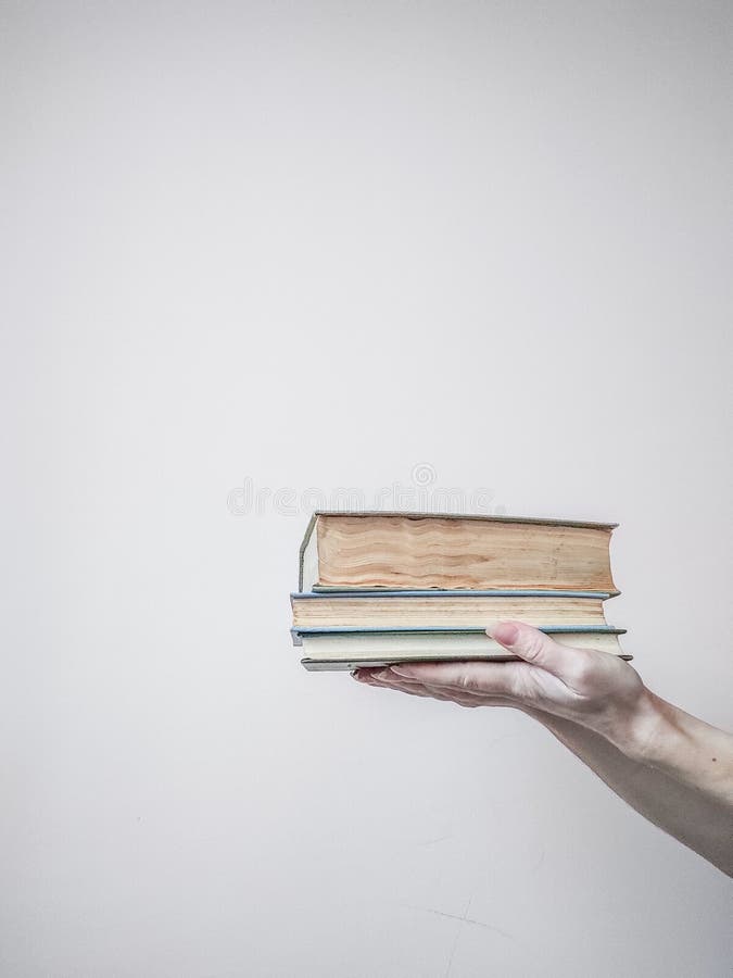 Hand holding books stock image. Image of text, drawing - 235915341