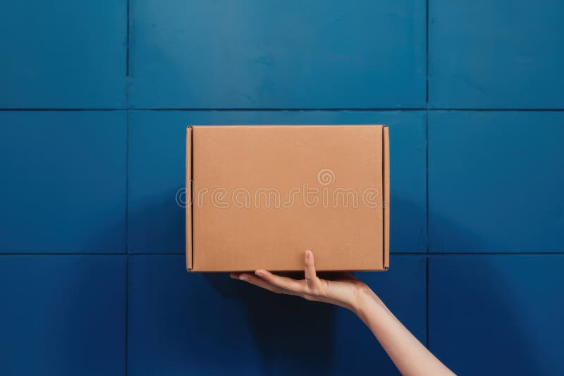 A Hand Holding a Box Against Blue Tile Wall, AI Stock Illustration ...