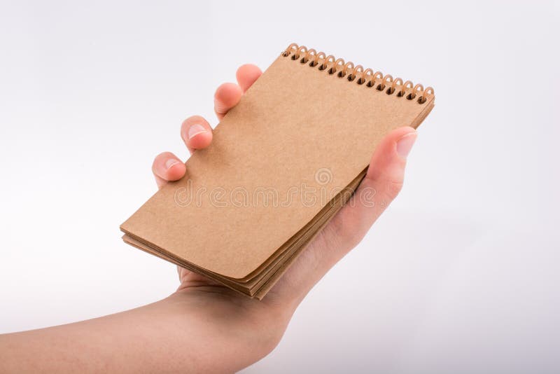 Hand holding a notebook stock image. Image of pedagogy - 141635049