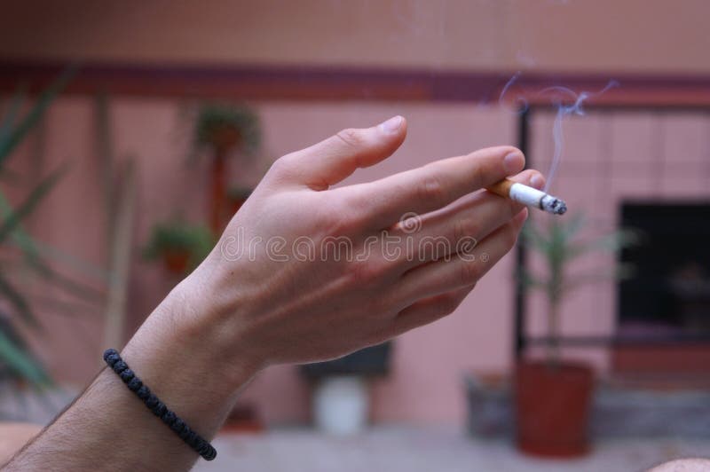 Hand Holding Burning Cigarette. Stock Photo - Image of halffinished ...