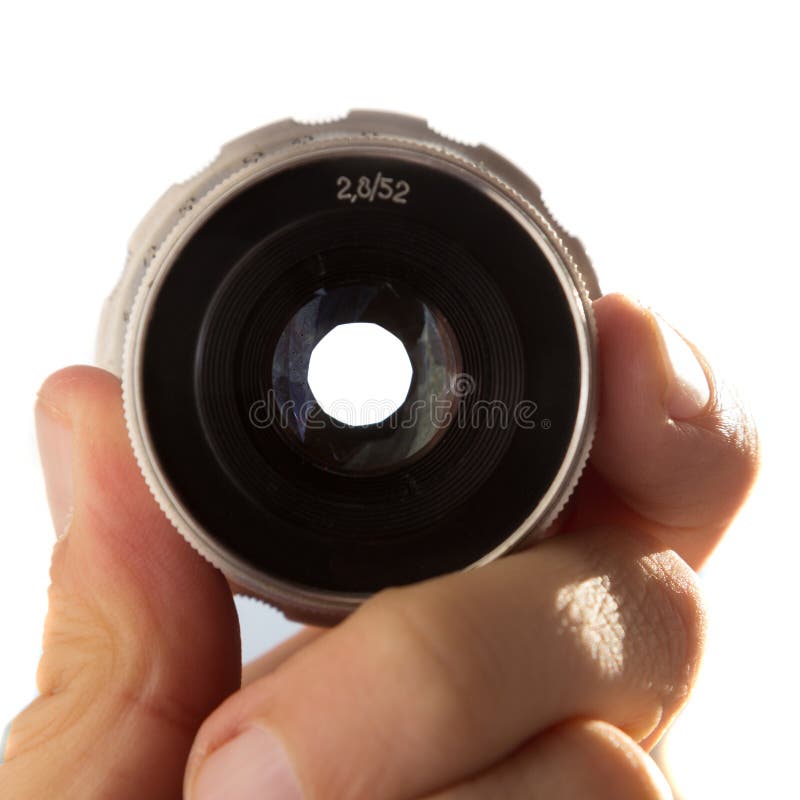 Hand Holding Camera Lens on White Background Stock Photo - Image of ...