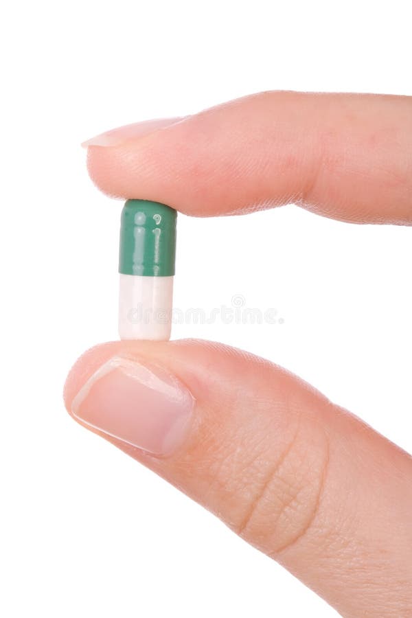 Hand Holding a Capsule or Pill Stock Photo - Image of medicament, hand ...