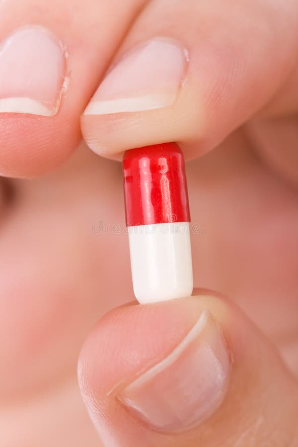 Hand Holding a Capsule or Pill Stock Photo - Image of capsules, pills ...