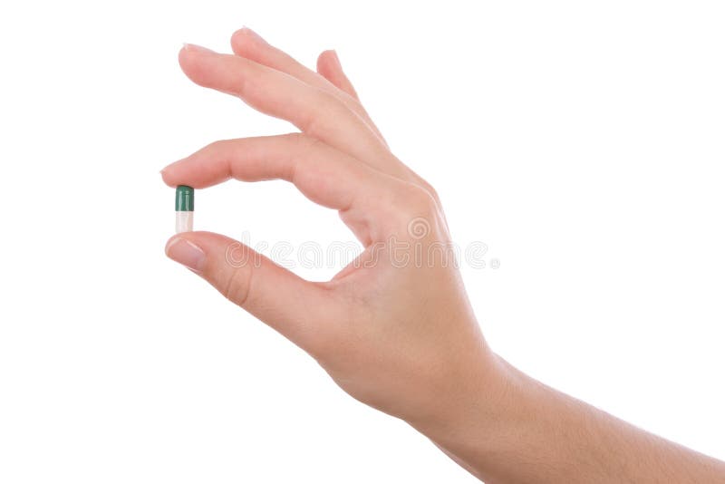 Hand Holding a Capsule or Pill Isolated Stock Photo - Image of ...