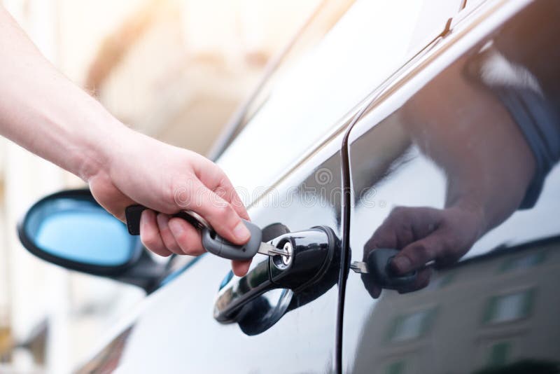 Hand Holding a Car Key and Opening the Car Door Stock Photo - Image of ...