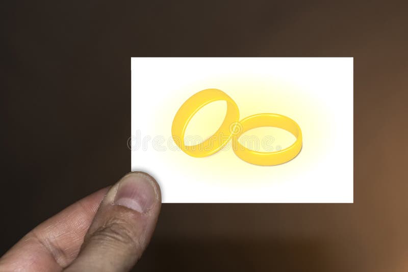 Hand Holding Card Decorated with Golden Rings Stock Image - Image of ...