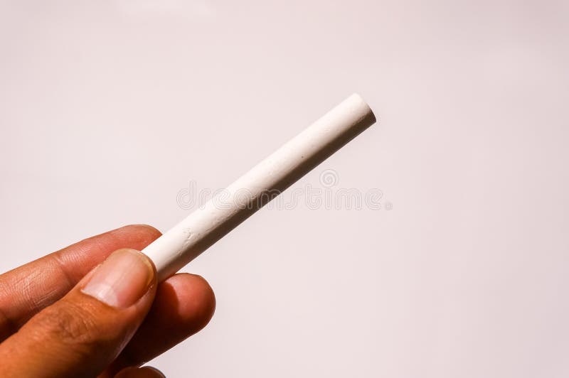 Hand holding a chalk stock image. Image of handwriting - 100163479