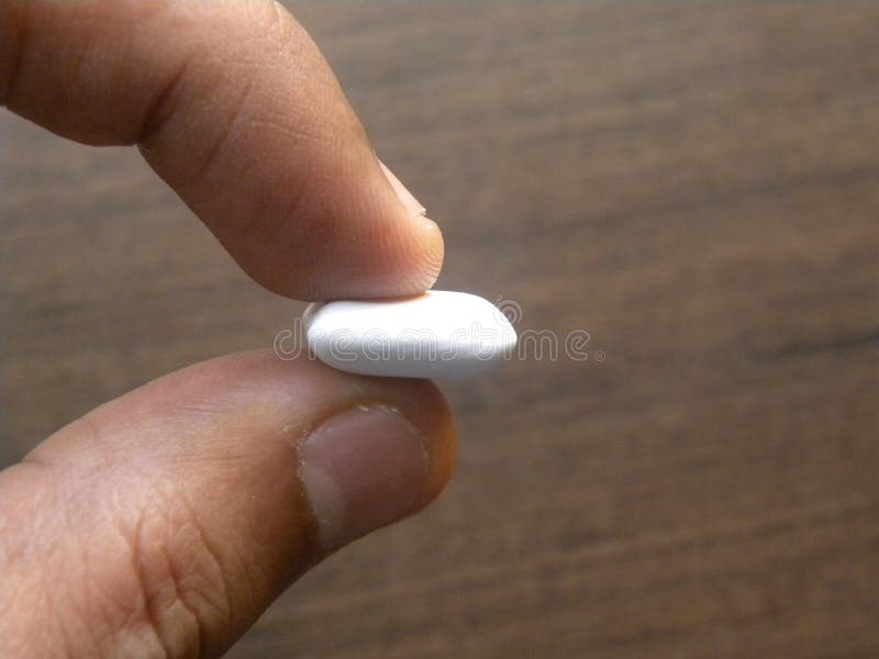 Hand holding Chewing gum stock image. Image of health - 127514145