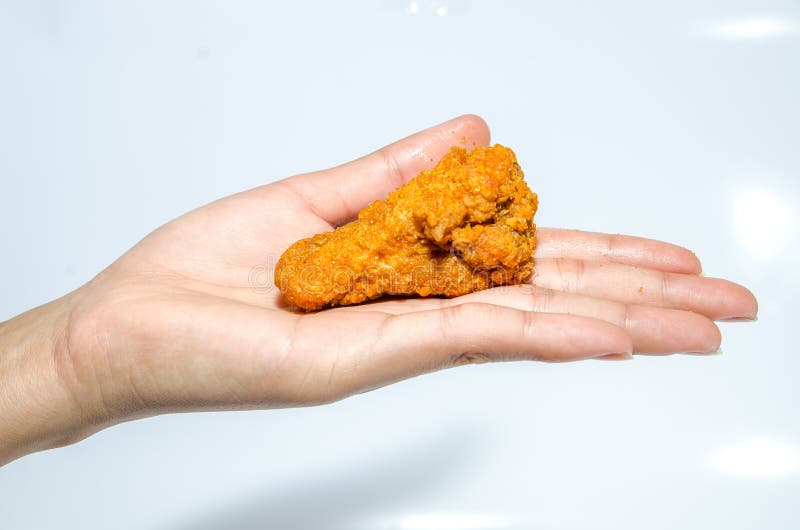 Hand holding Chicken Wing stock image. Image of cooked - 94975809
