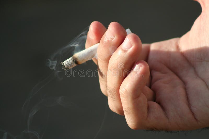 Hand Holding a Cigarette stock photo. Image of hold, nicotine - 13817314