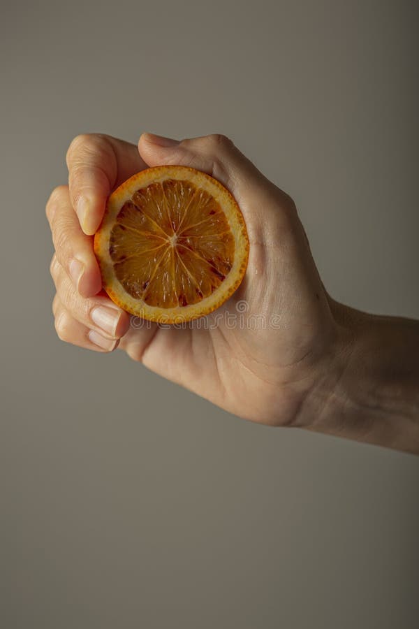 Hand Holding a Circular Slice of Orange Stock Image - Image of orange ...