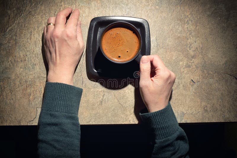 Hand holding coffee cup stock photo. Image of drink - 145084286