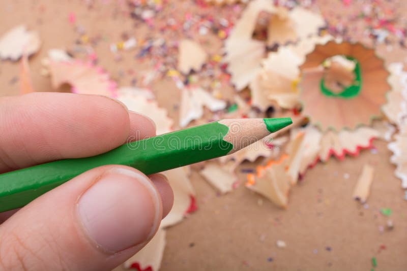 Hand Holding Color Pencil Over a Notebook Stock Image - Image of wood ...