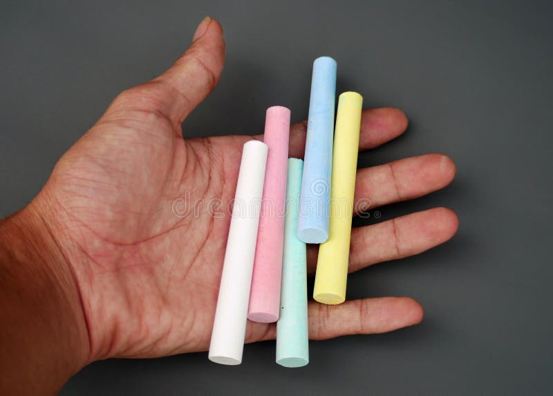A Hand Holding Colorful Chalk. Back To School. Stock Photo - Image of ...