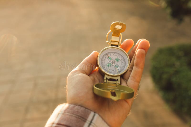 A Hand Holding a Compass Pointing To the North Stock Image - Image of ...