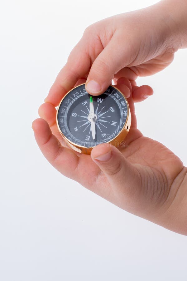 Hand Holding A Compass On White Background Stock Image - Image of ...