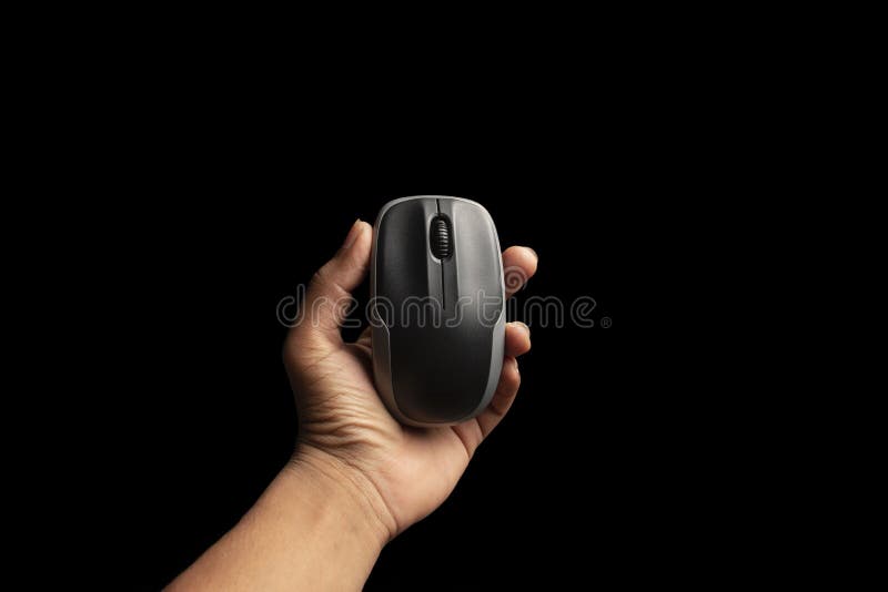 Hand Holding Computer Mouse Isolated on the Black Background. Above ...