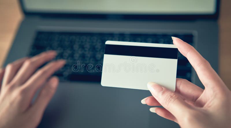 Hand Holding Credit Card and Press Laptop Computer Enter the Payment ...