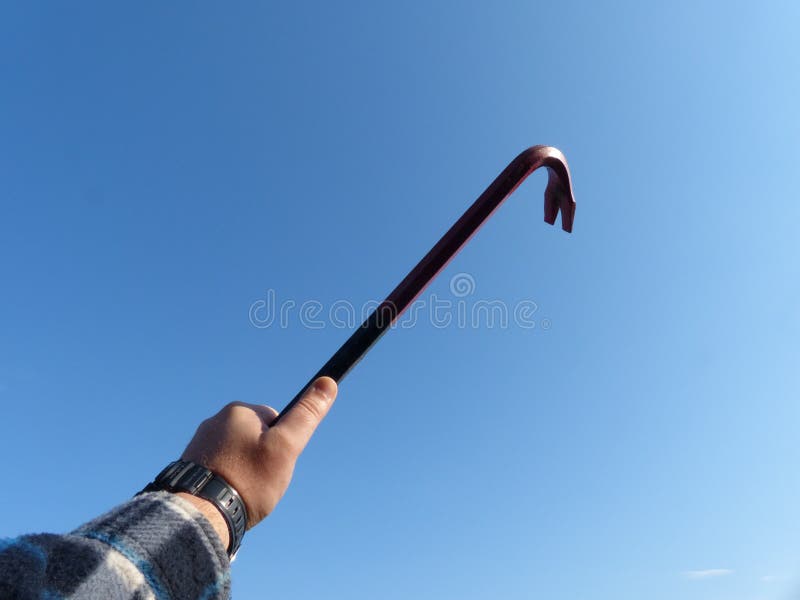A Hand Holding a Crowbar in the Air Stock Image - Image of male ...