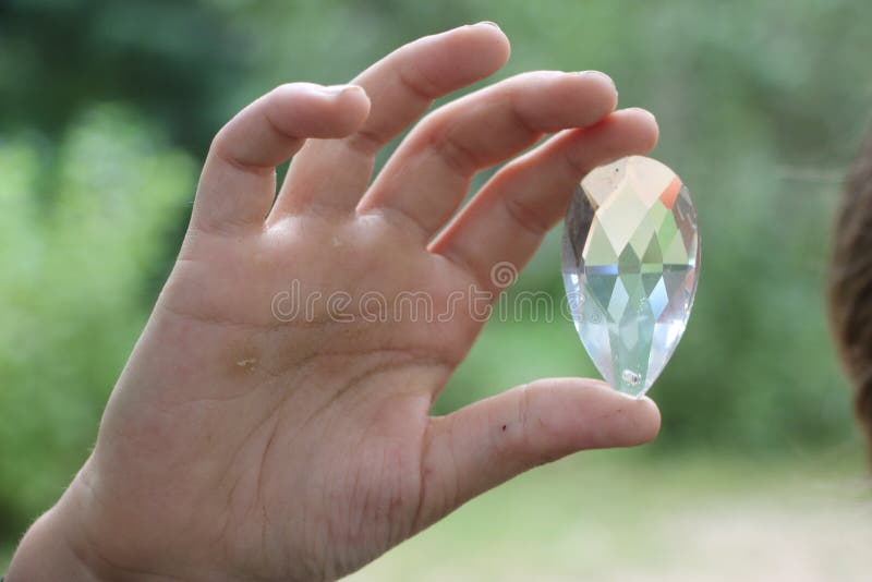 Hand Holding a Crystal of Glass Considered To Be Magic. Esoteric Magic ...