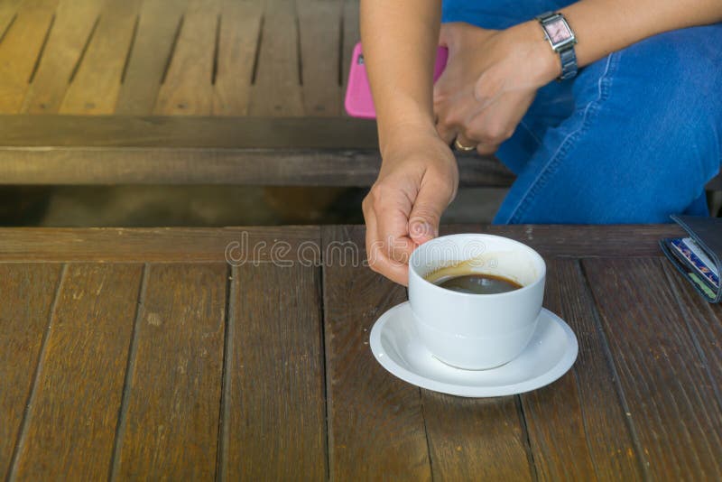 Hand Holding a Cup of Black Coffee in Coffee Shop. Stock Image - Image ...