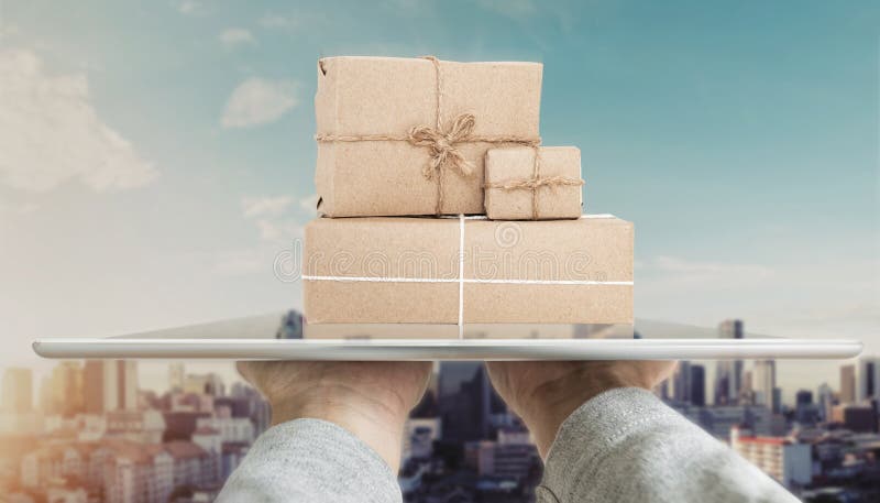 Hand Holding Digital Tablet with Parcel Post Boxes on Screen. Online ...
