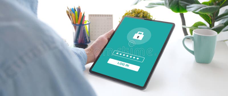 Hand Holding Digital Tablet with Password Login on Screen at Working ...