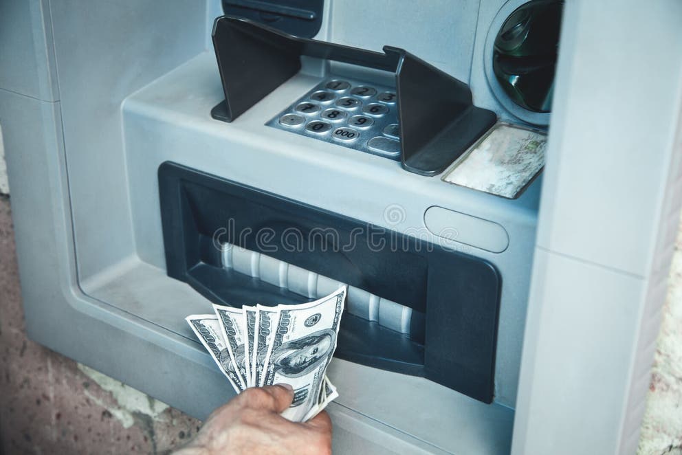 Hand Holding Dollars Withdrawn from ATM Stock Photo - Image of hand ...