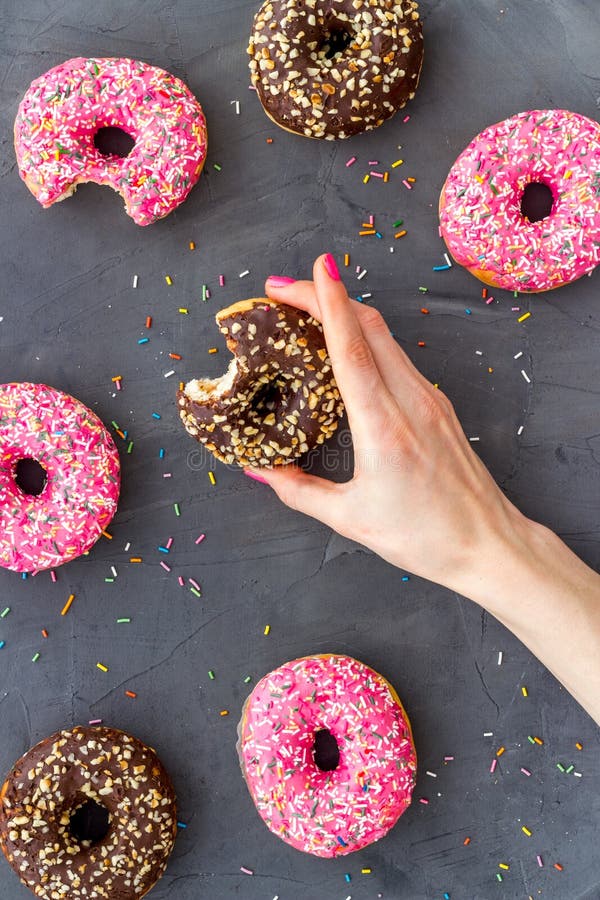 Hand Holding Donut with Icing and Sprinkles. Flat Lay, Top View Stock ...