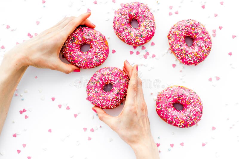 Hand Holding Donut with Icing and Sprinkles. Flat Lay, Top View Stock ...