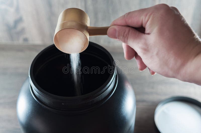 Hand Holding Doser and Pouring Food Supplement Stock Image - Image of ...
