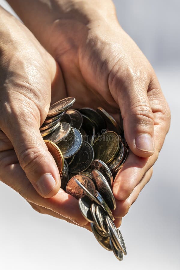 A Hand Holding and Dropping Coins Editorial Stock Image - Image of ...