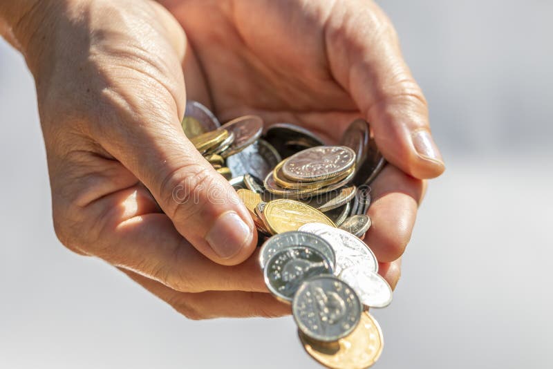 A Hand Holding and Dropping Coins Editorial Photo - Image of currency ...