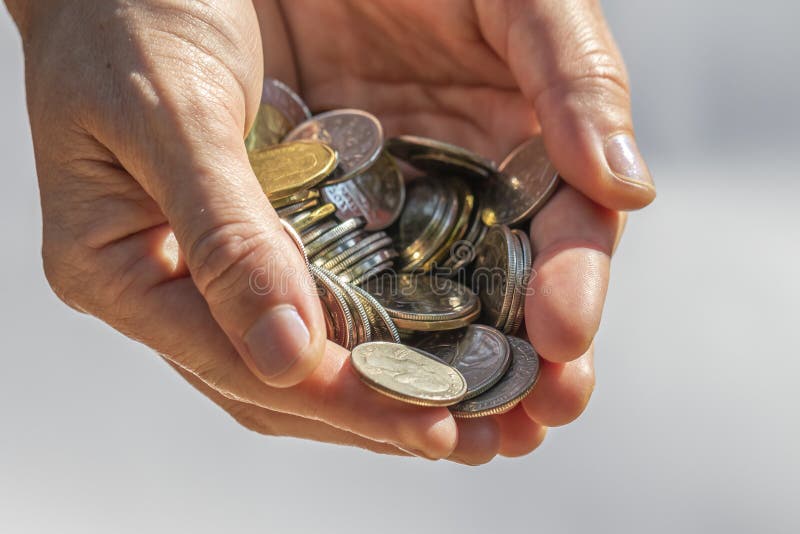 A Hand Holding and Dropping Coins Editorial Stock Photo - Image of ...