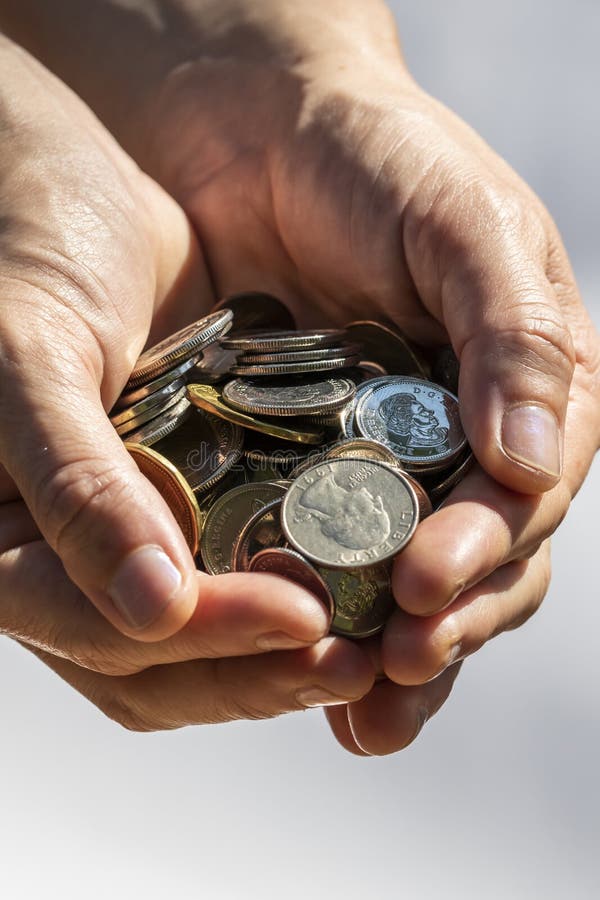 A Hand Holding and Dropping Coins Editorial Image - Image of coin, drop ...