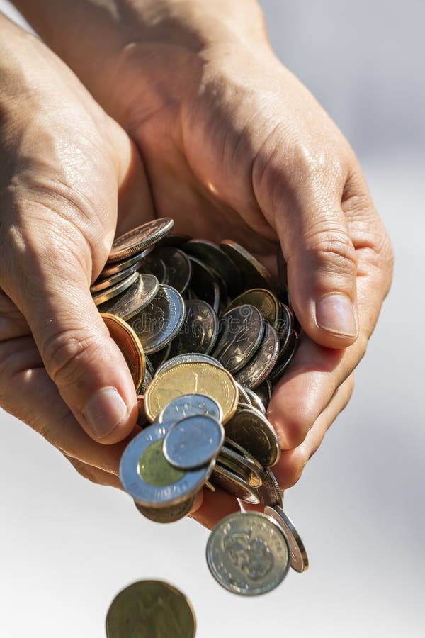A Hand Holding and Dropping Coins Editorial Photography - Image of palm ...