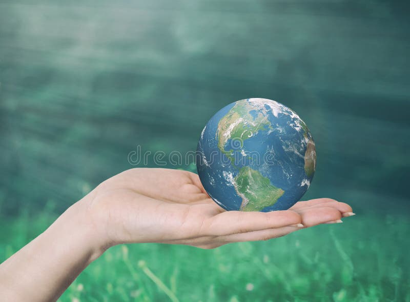 Hand Holding Earth in Lush Green Environment with Sunlight - Caring for ...
