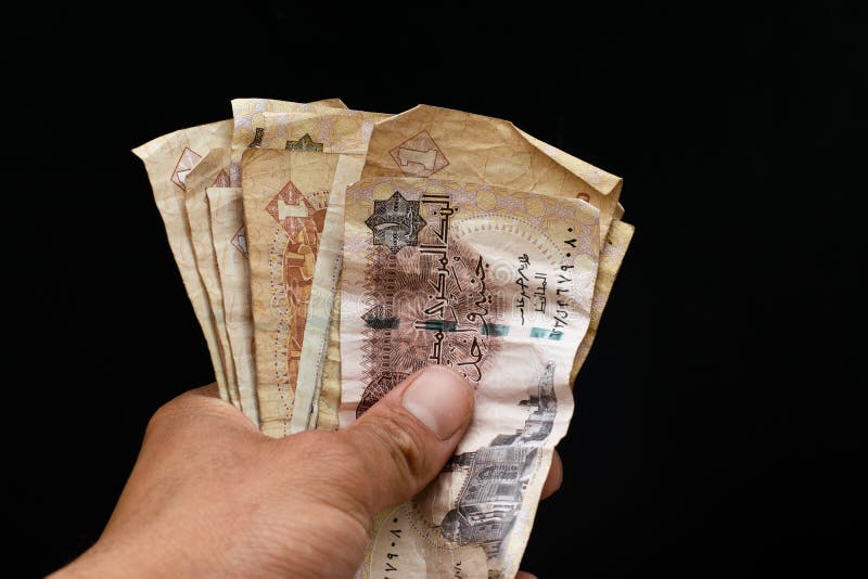 A Hand Holding Egyptian Pounds. Egyptian Money Stock Photo - Image of ...