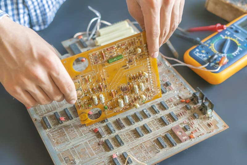 Hand Holding an Electric Circuit Board Repair Fix and Assemble ...