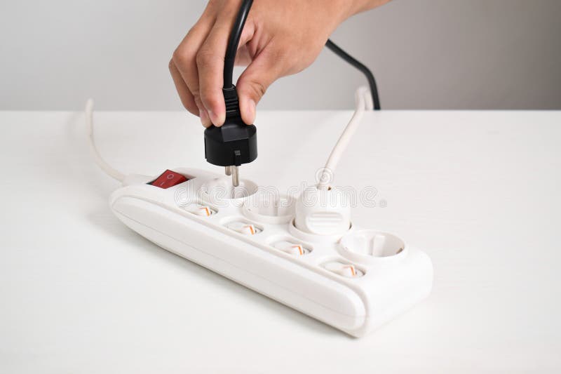 Hand Holding Electric Plug, Multiple Socket with Connected Plugs. Stock ... Hand Holding Electric Plug, Multiple Socket with Connected Plugs. Stock ...
