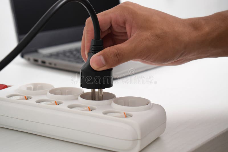 Hand Holding Electric Plug, Multiple Socket with Connected Plugs Stock ... Hand Holding Electric Plug, Multiple Socket with Connected Plugs Stock ...