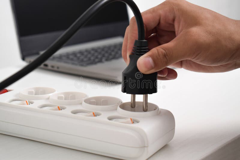 Hand Holding Electric Plug, Multiple Socket with Connected Plugs Stock ...