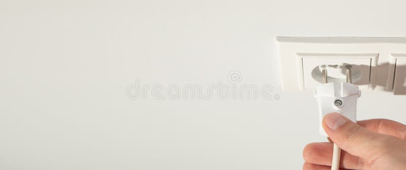Hand Holding Electric Plug into a Power Outlet Stock Image - Image of ...